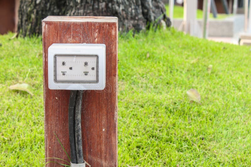 Electric Plug in the Garden Stock Image - Image of power, green: 101168285
