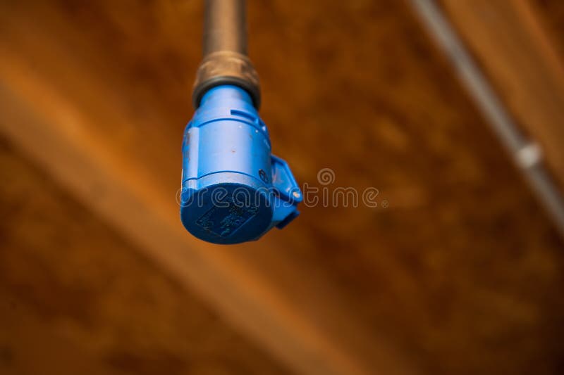 Electric Plug Hanging from Ceiling in Workshop Stock Image - Image of ...