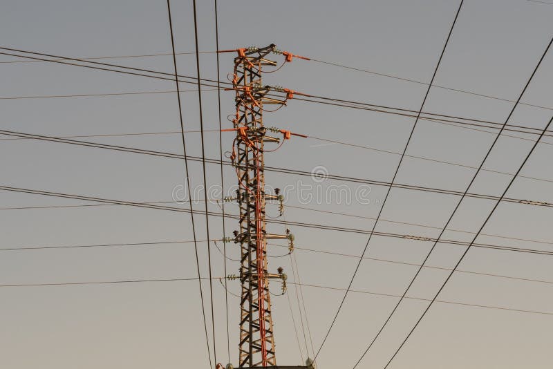 Electric Pole and Cables on a Clear Sky Background at the Sunset Stock ...