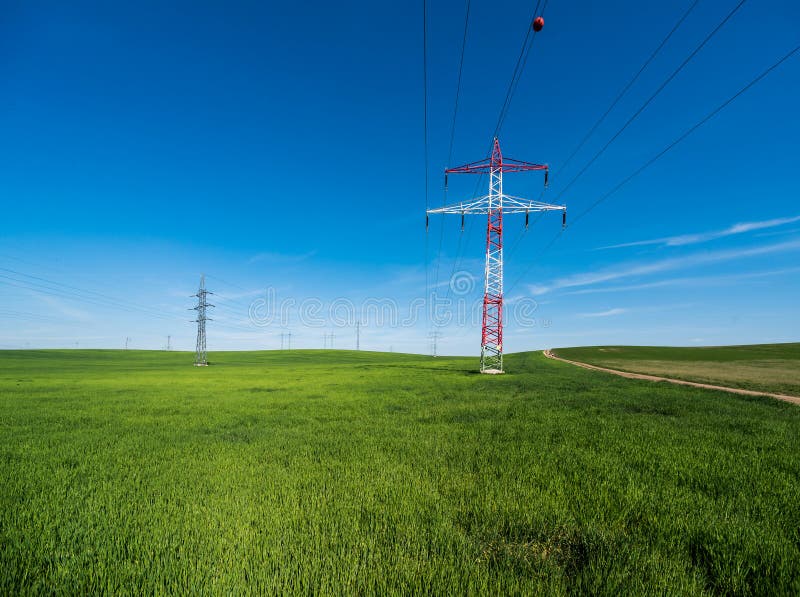 Electric Pole in the Center of the Beautiful Green Fields Stock Photo ...