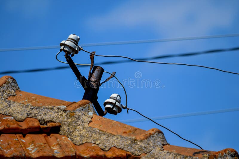 Electric pole on the house stock photo. Image of ampere - 325821162