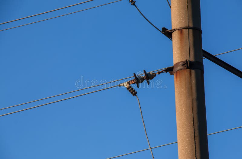 Electric Pole with a Linear Wire Against the Blue Sky Close-up. Power ...