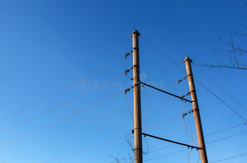 Electric Pole with a Linear Wire Against the Blue Sky Close-up. Power ...