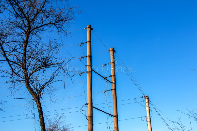 Electric Pole with a Linear Wire Against the Blue Sky Close-up. Power ...