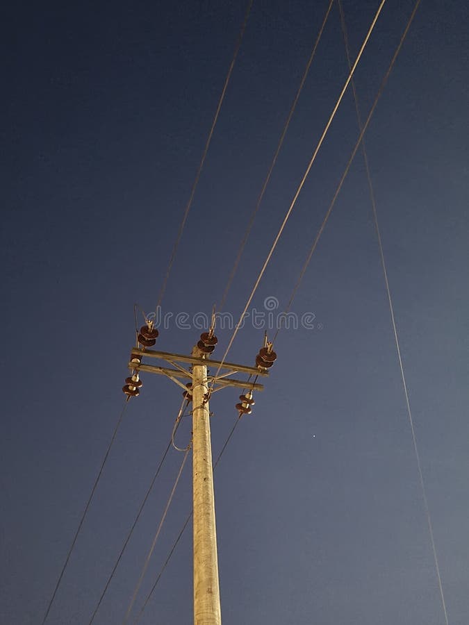 Electric Pole at Night with Light from City Light Stock Photo - Image ...