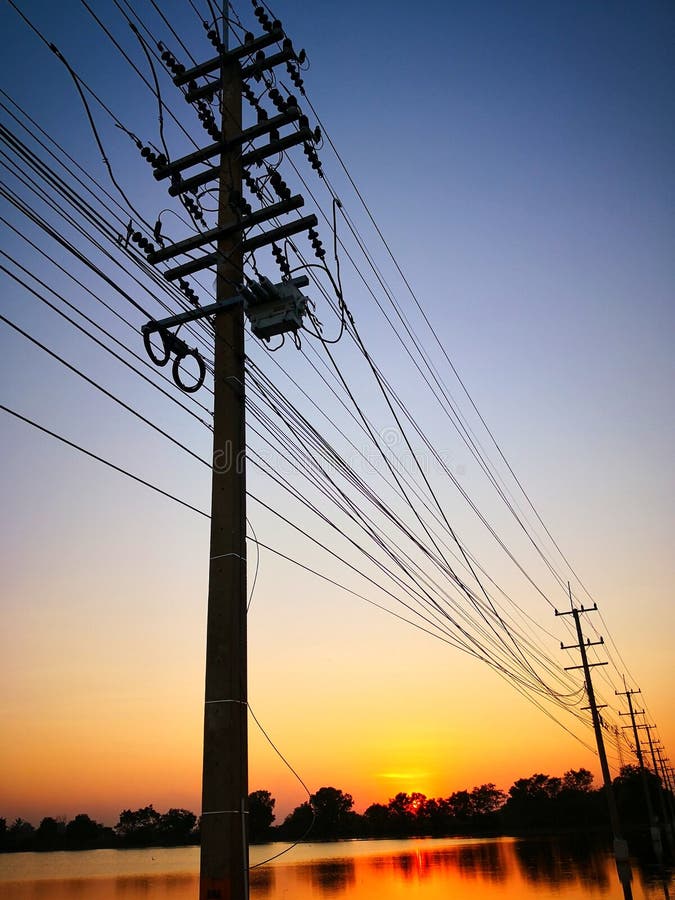 Electric Pole and Riverside Sunset View. Stock Image - Image of ...
