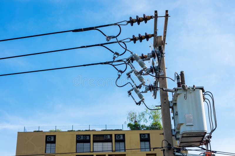 An Electric Pole with Transformer High Voltage on Blue Sky Background ...