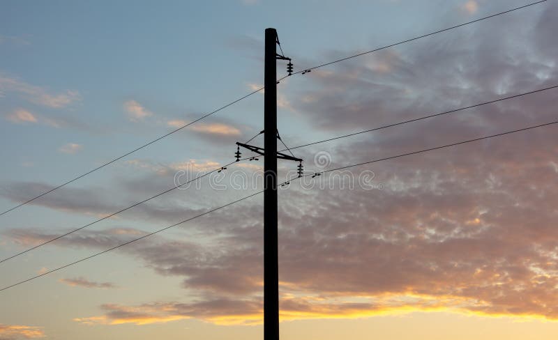 Electric Pole with Wires Against the Backdrop of the Sunset Stock Photo ...
