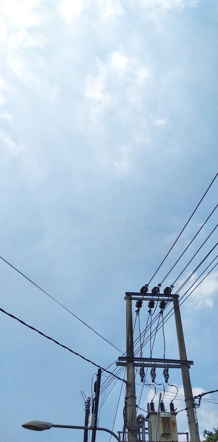 Electric Poles and Cables Along with Street Light with Blue Sky Stock ...