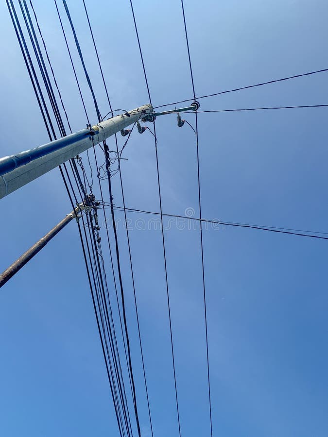 Electric Poles and Cables Running Across Stock Photo - Image of steel ...
