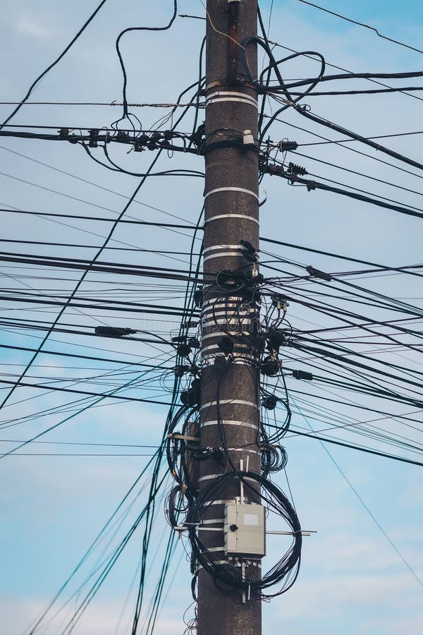 Electric Poles and Cables and Set Against a Blue Sky. Electric Pole ...