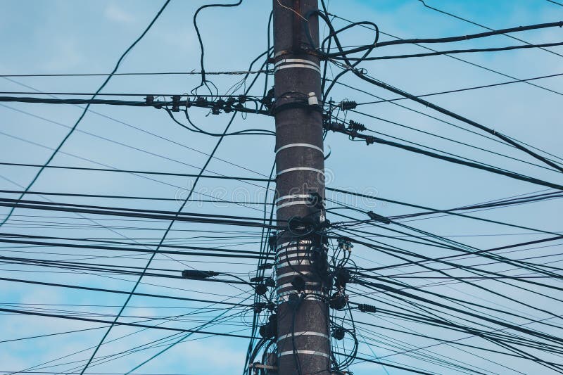 Electric Poles and Cables and Set Against a Blue Sky. Electric Pole ...