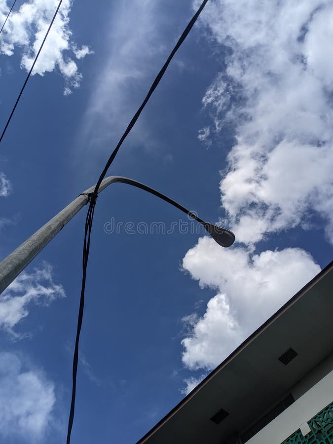 Electric Poles and Clouds during a Beautiful Day. Stock Image - Image ...