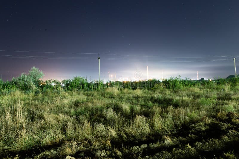 Electric Poles in the Field at Night Stock Photo - Image of silhouette ...