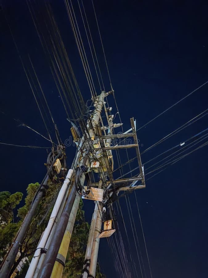 Electric Poles Full of Wires at Night Stock Photo - Image of electric ...