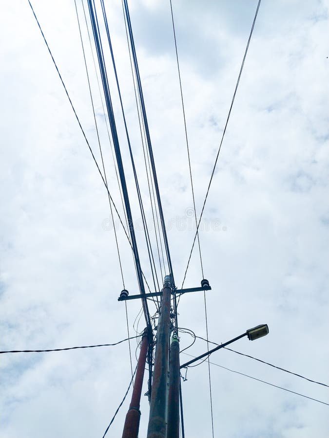 Electric Poles and Internet Cable Poles Huddled Close Together Stock ...