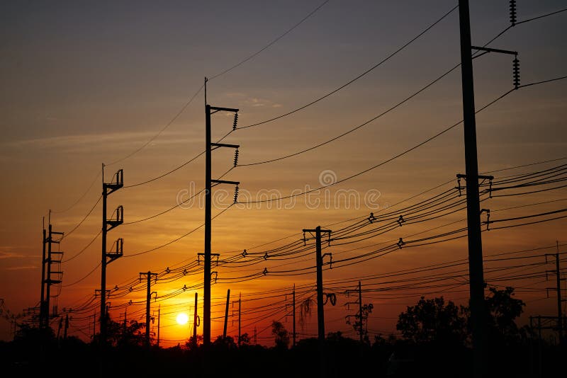 The Electric Poles and Electric Lines with a Sky of Sunset Stock Photo ...