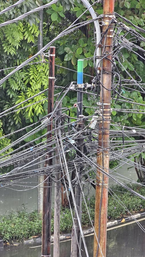 Electric Poles with Messy Cables and with Still Droplets after the Rain ...