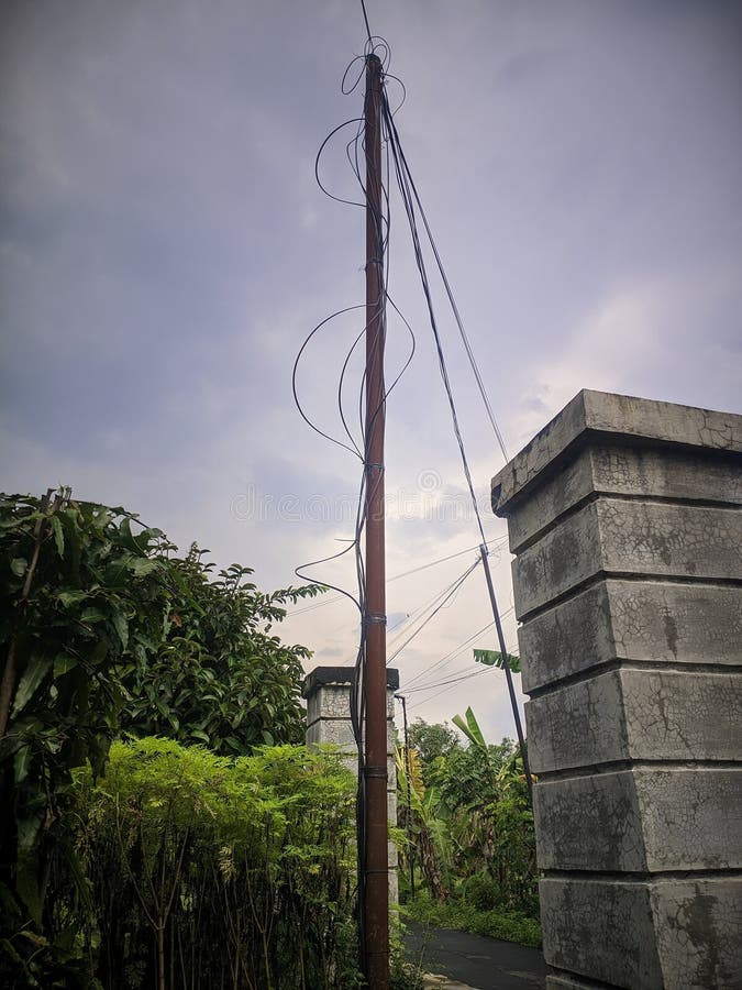 Electric Poles with Scattered in Front of the House Stock Image - Image ...