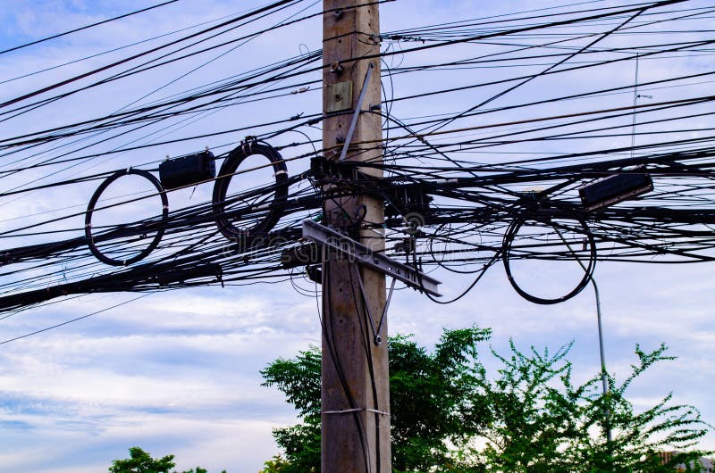 Electric Poles with Tangled Electrical Wires Nestled Stock Image ...