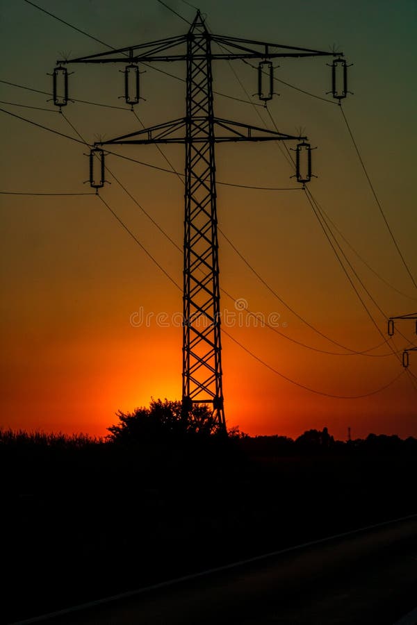 Electric Power Pylon, Electric Tower at Sunset Stock Photo - Image of ...
