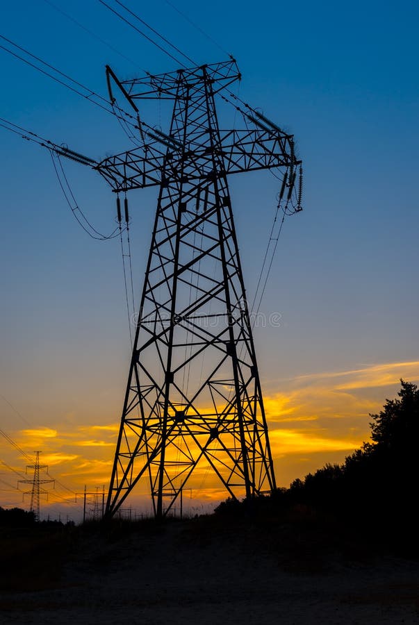 Electric pylon at sunset stock image. Image of transmission - 75939905