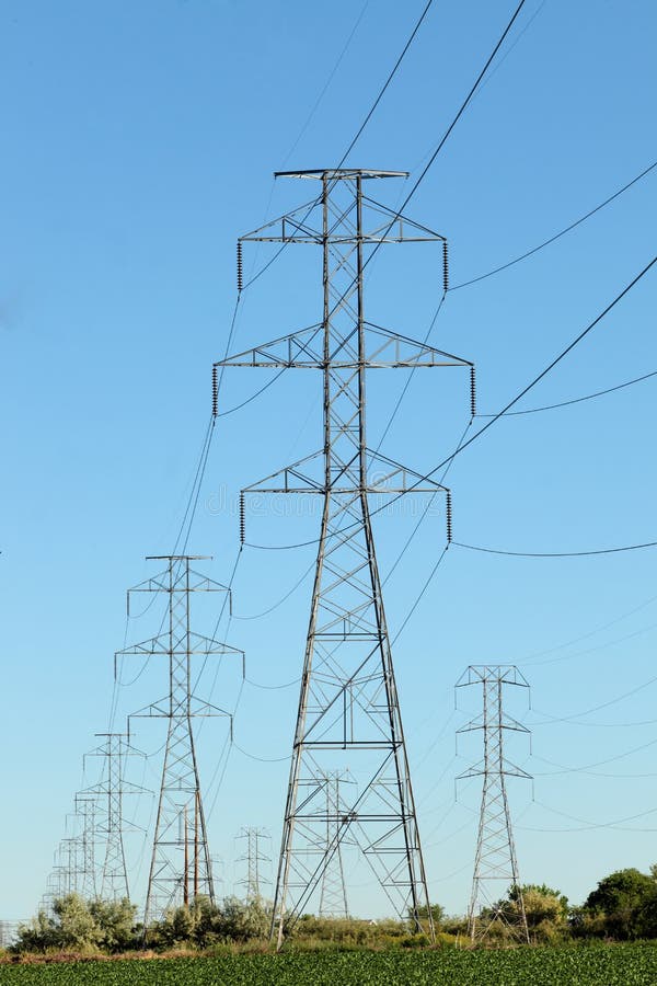 Power Lines Suspended from Electrical Pylons. Stock Photo - Image of ...