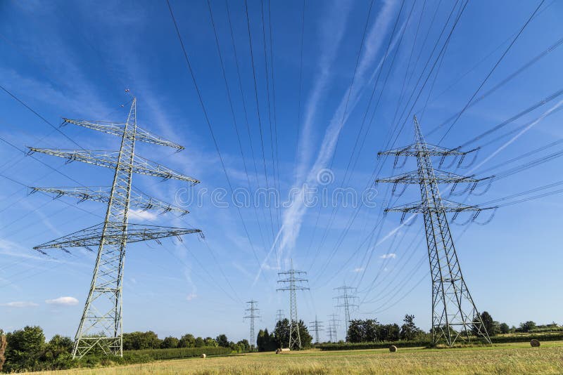 Electric Pylons Transporting Electricity through High Tension Ca Stock ...