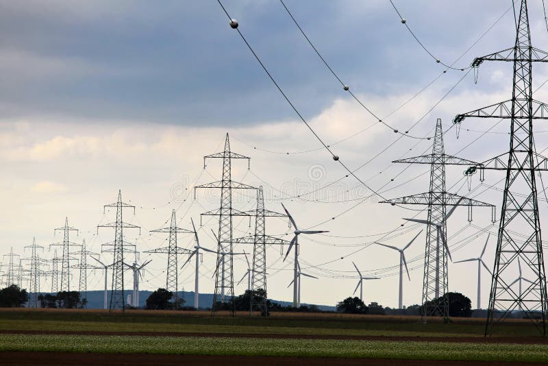 Electric Pylons and Wind Farm Stock Image - Image of pylons, overhead ...