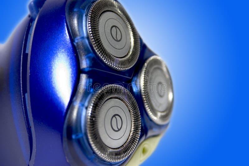 Man with Electric Razor Shaving Face in Bathroom. Men Grooming Stock ...