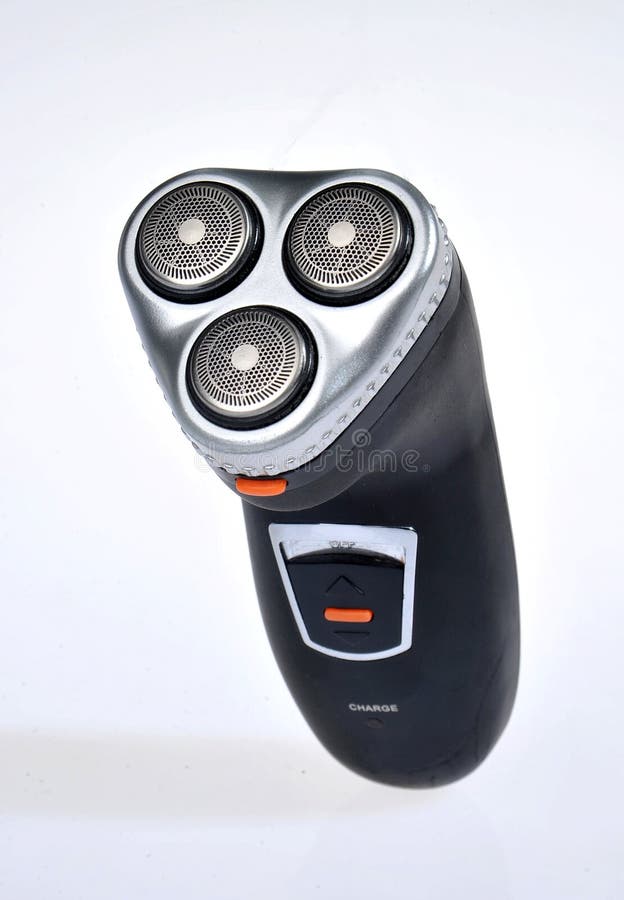 Man with Electric Razor Shaving Face in Bathroom. Men Grooming Stock ...