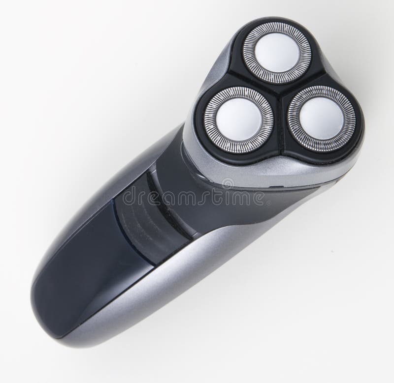 Man with Electric Razor Shaving Face in Bathroom. Men Grooming Stock ...