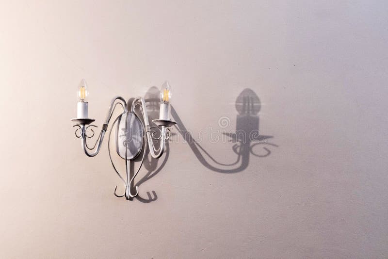 Electric Sconce with a Shadow on a Light Wall. Stock Image - Image of ...