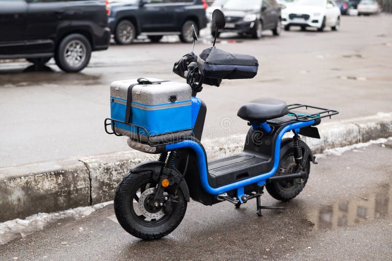 An Electric Scooter for Cargo Transportation with a Front and Rear ...