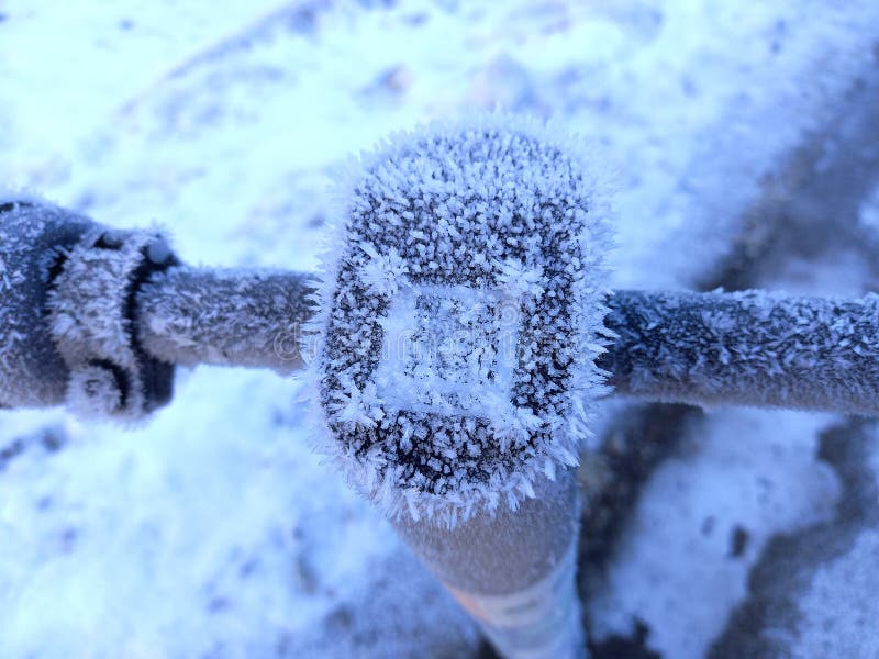 Electric Scooter QR Code Validating on Freezing Day Covered with Ice ...
