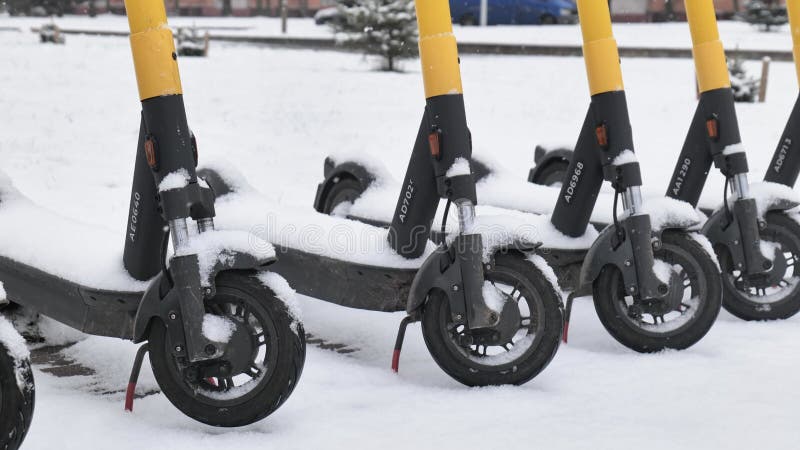 Electric Scooters Under the Snow during a Snowfall Stock Video - Video ...