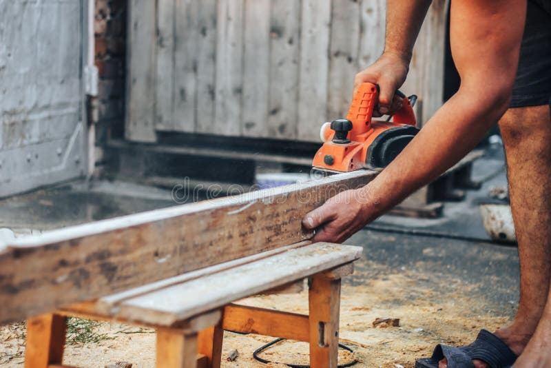 Electric Scraper To Plane the Board Stock Image - Image of male, hand ...