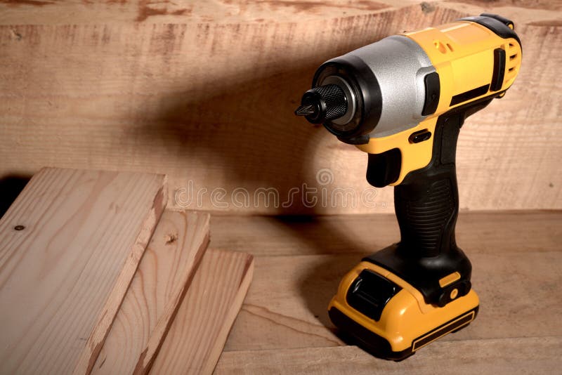 Electric Screwdriver and the Board on the Table Stock Image - Image of ...
