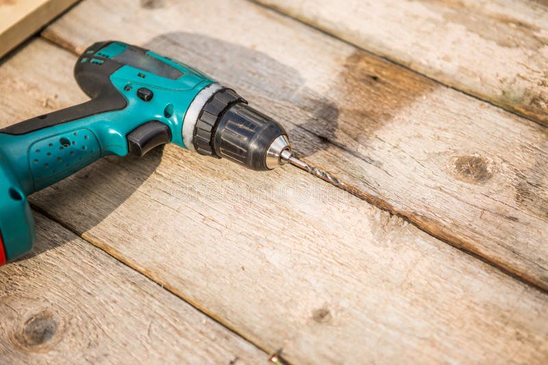Electric Screwdriver on Wood Table Stock Photo - Image of joinery ...
