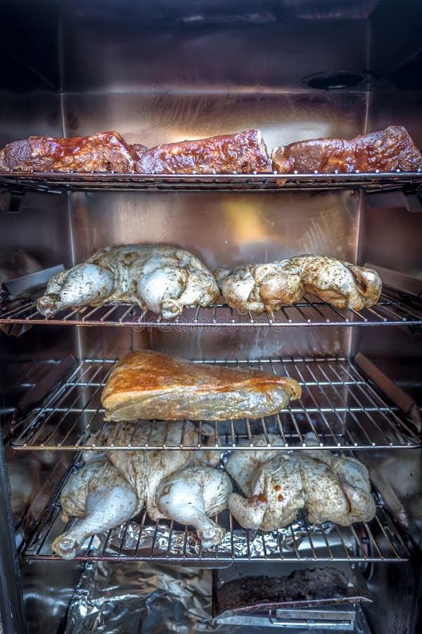 Electric Smoker Loaded with Variety of Meat Stock Photo - Image of iron ...