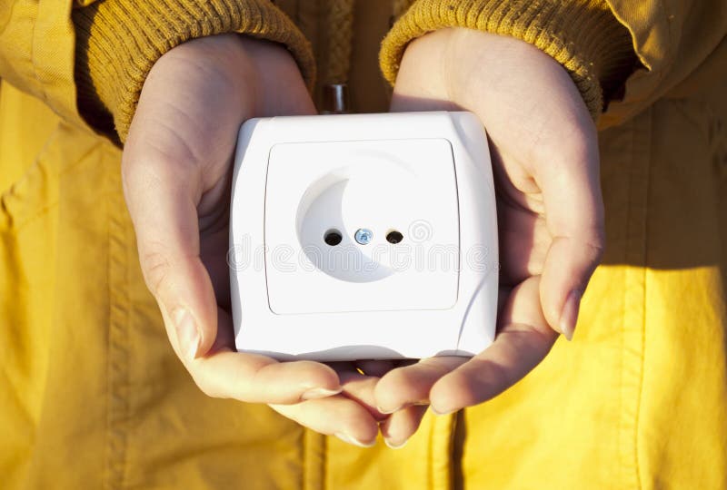 Electric socket in hands. stock photo. Image of female - 66630068