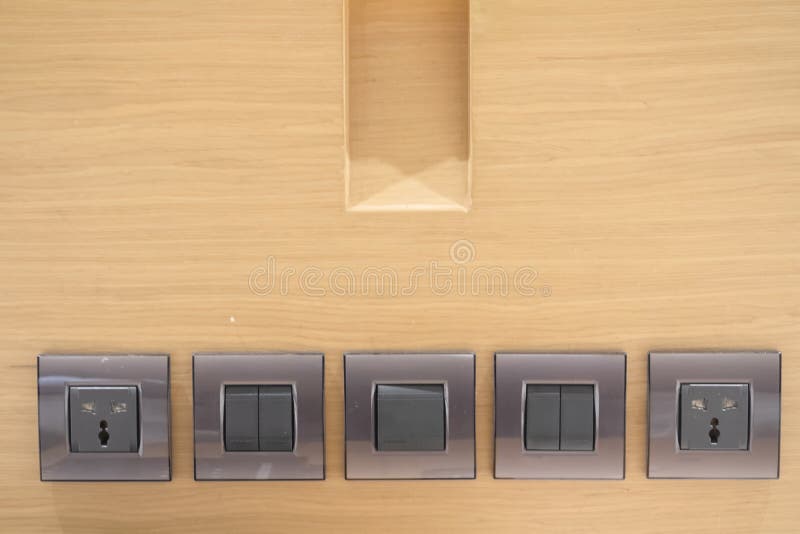 Electric Socket and Light Switch Panel on Wood Wall Stock Image - Image ...