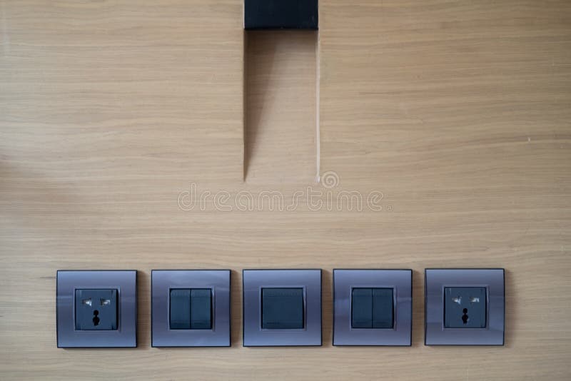 Electric Socket and Light Switch Panel on Wood Wall Stock Photo - Image ...