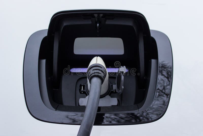 Electric Socket Plugged To Charge Electric Car Stock Photo - Image of ...