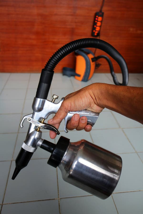 Electric Sprayer with Wooden Wall. Stock Image - Image of male, green ...