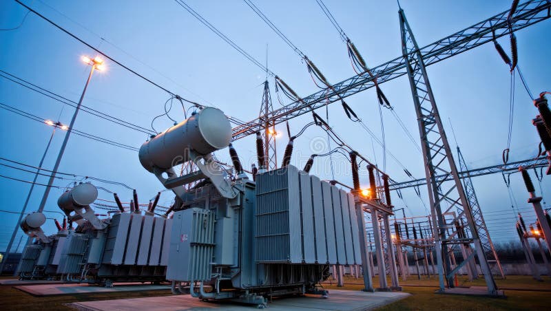 Electric Substation with High-voltage Transformers and Lines at Dusk ...