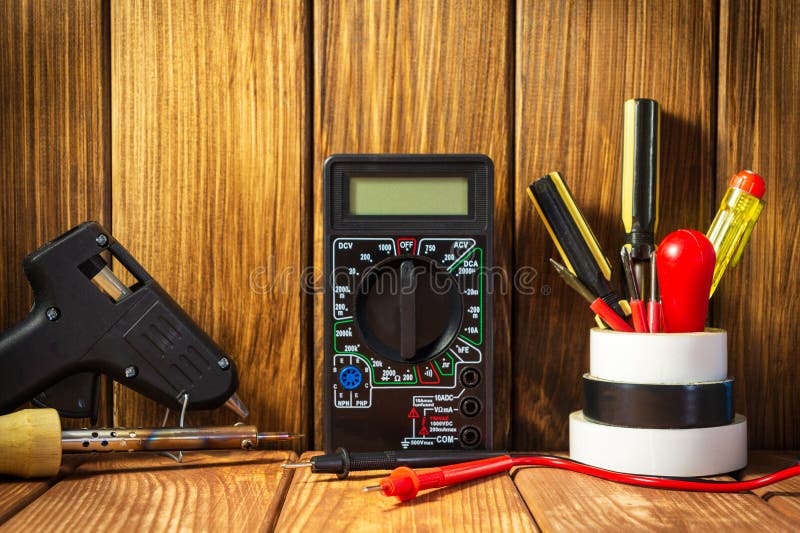 Electric Tester and Electronics Tool Kit on Wooden Background Stock ...