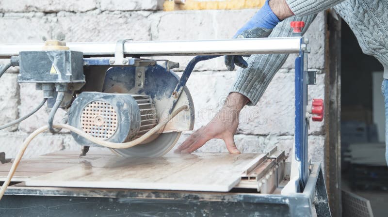 Electric Tile Cutter. Tiler Cutting Tile on Wet Saw Machine Stock Image ...