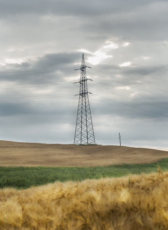 Electric tower in fields stock photo. Image of energy - 74292506