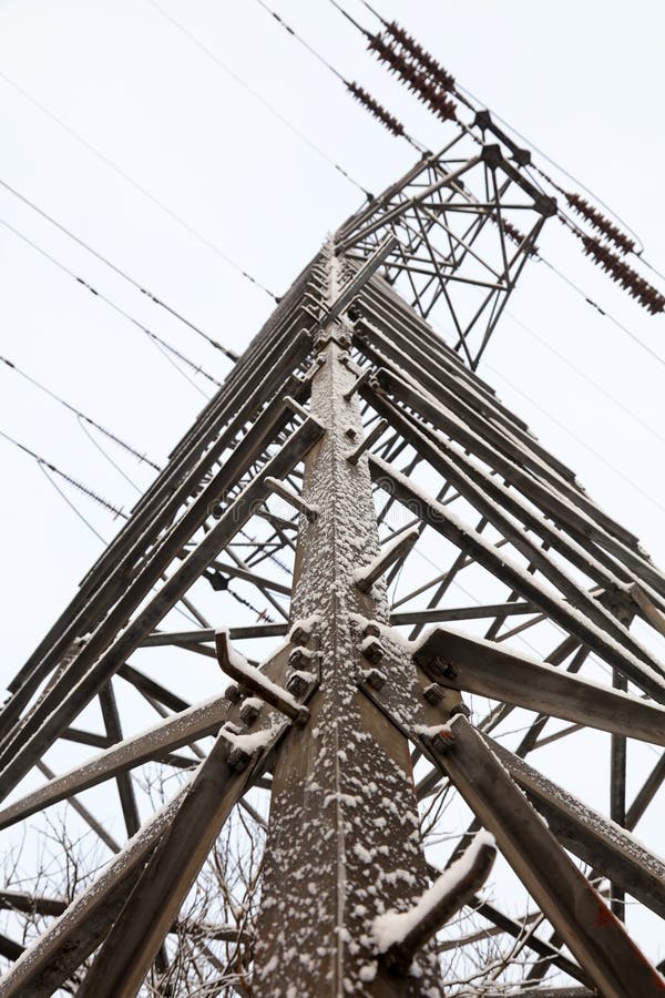 Electric tower in snow stock photo. Image of outdoor - 382788536